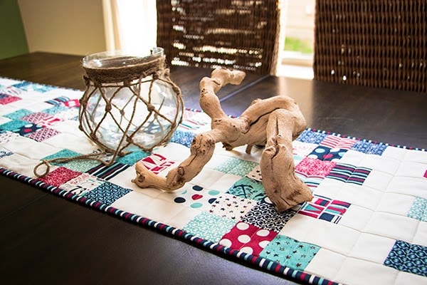 Mini Charm Mix table runner in The Boat House collection.