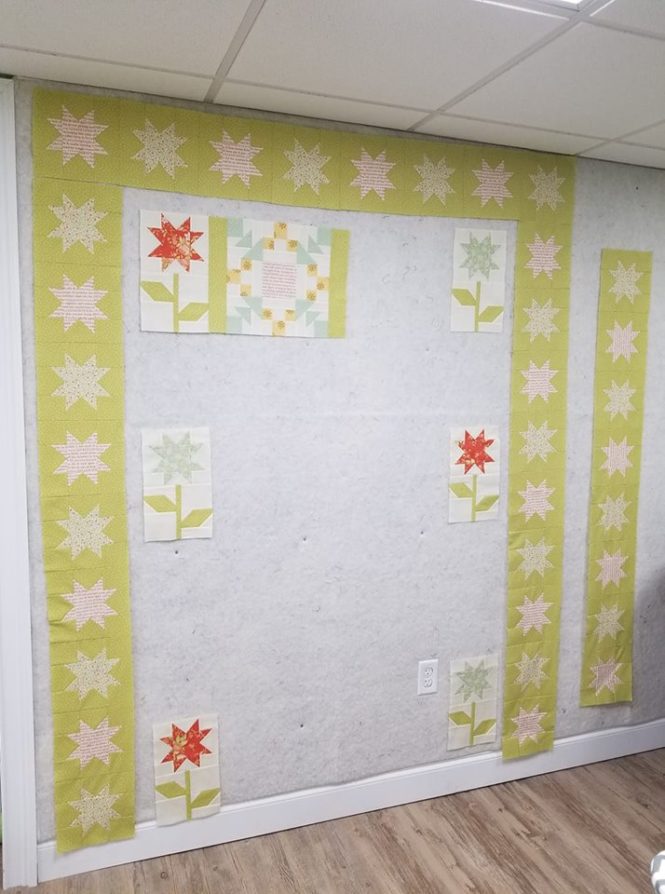 Club member Diane Snyder uses her nifty design wall to lay the quilt ...