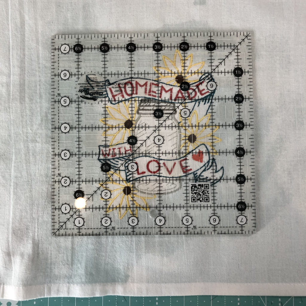 1.Center your Creative Grids 7.5″ Quilting Square Ruler over the design ...