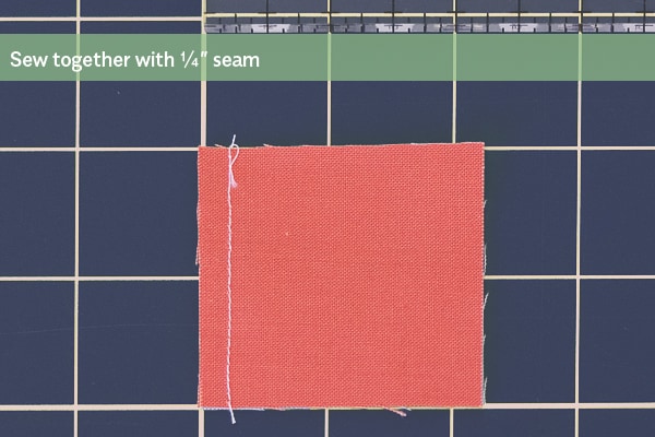 Take two, 2.25″ squares and sew them together using a 1/4″ seam.