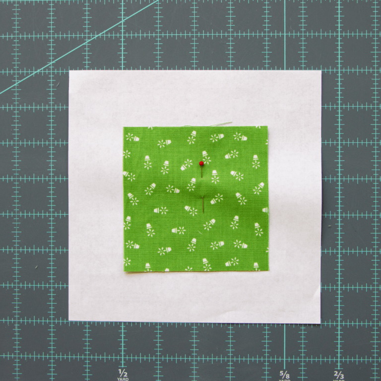 Center the Placement 1 fabric square right side up on the wrong side of ...