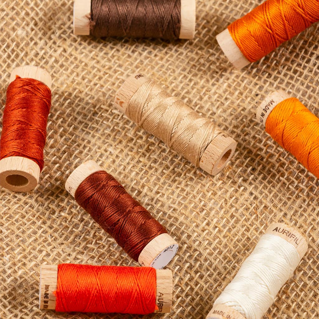 The deep colors of fall in this piece are cozy and nice with just a ...