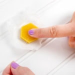 If the wax disc is too cool to work with, simply warm it in your hand ...