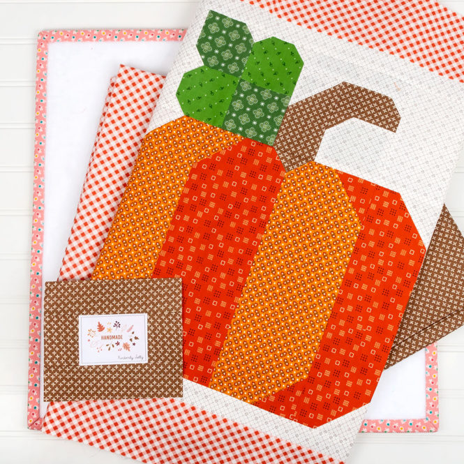 Our Calico Quilt Seeds Pumpkin Runner features oranges, greens, and ...
