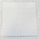 3. Peel off the backing from the self-stick mounting board and ...