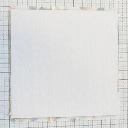 4. Next, fold the edges of your quilt block over to the back. Press ...