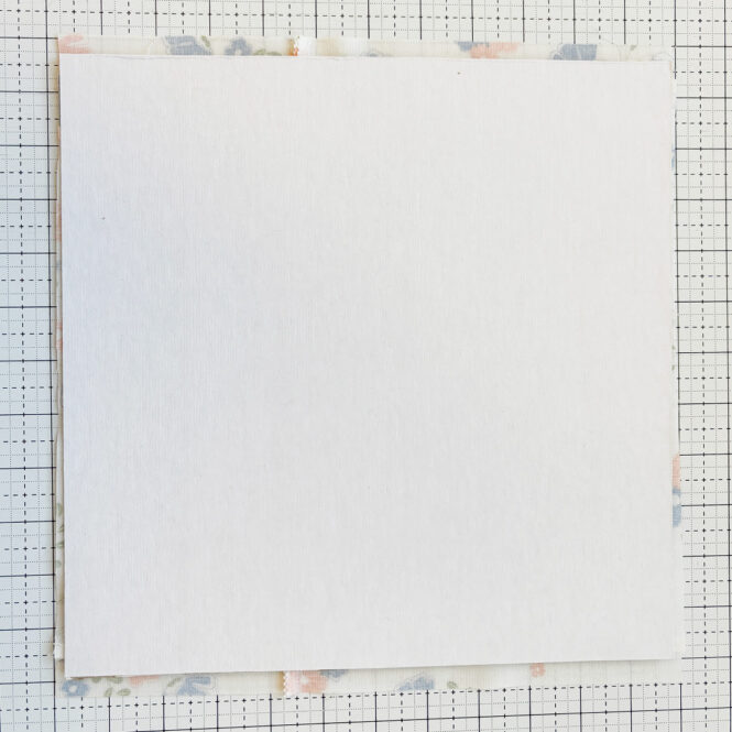 4. Next, fold the edges of your quilt block over to the back. Press ...