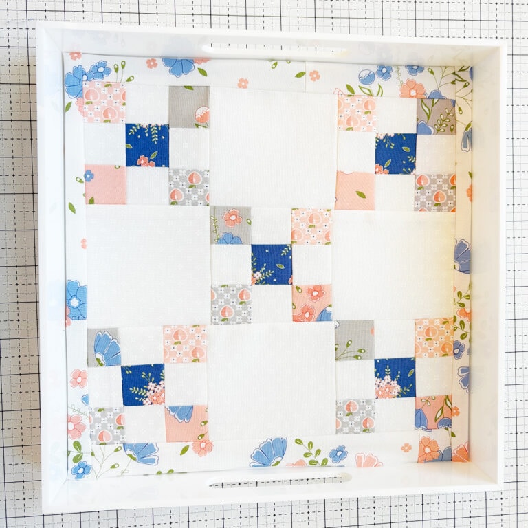 5. Slide the quilt block with the mounting board into the acrylic tray ...