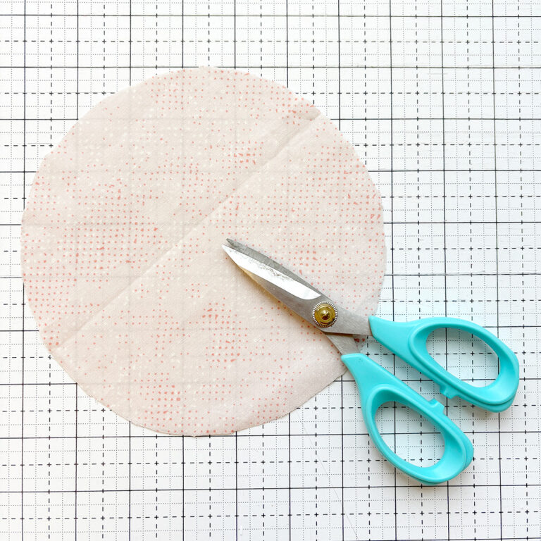 4. Next, take a needle and thread and stitch with a long running stitch around the outside edge ...