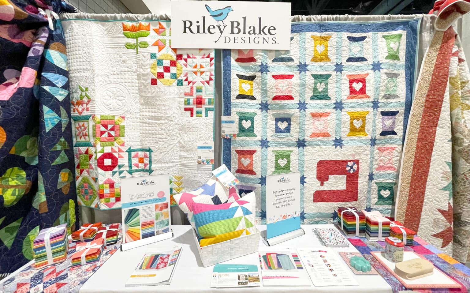 Beautiful quilts adorned the Riley Blake Designs booth, and we said ...