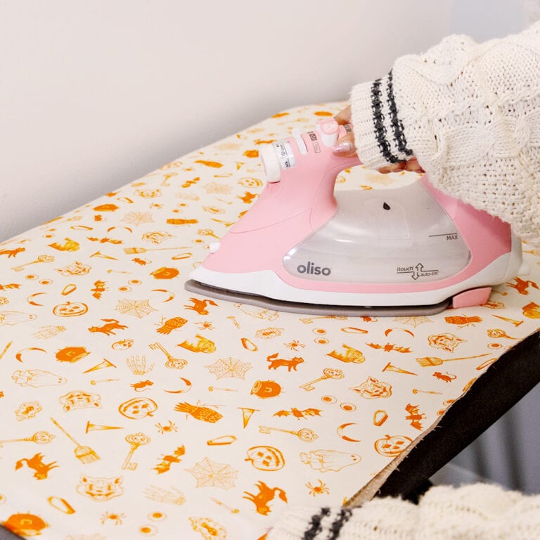 Follow the directions on the back of the Heat N Bond Ultrahold package ...