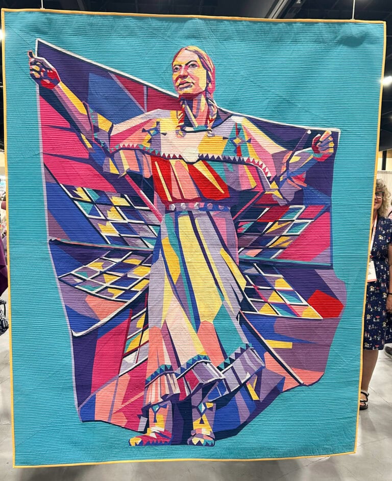 To see all the winning quilts in the 12 show categories, you can visit ...